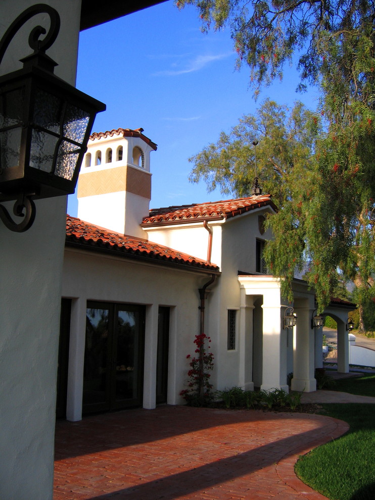 Santa Barbara style Spanish home with Brick Patio - Mediterranean ...