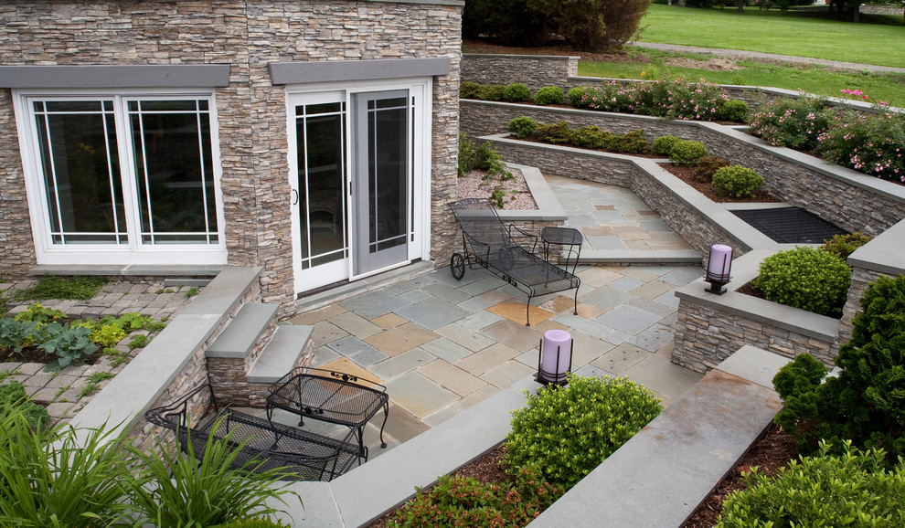 Stacked Stone Patio with Wrought Iron Patio Furniture - Traditional ...