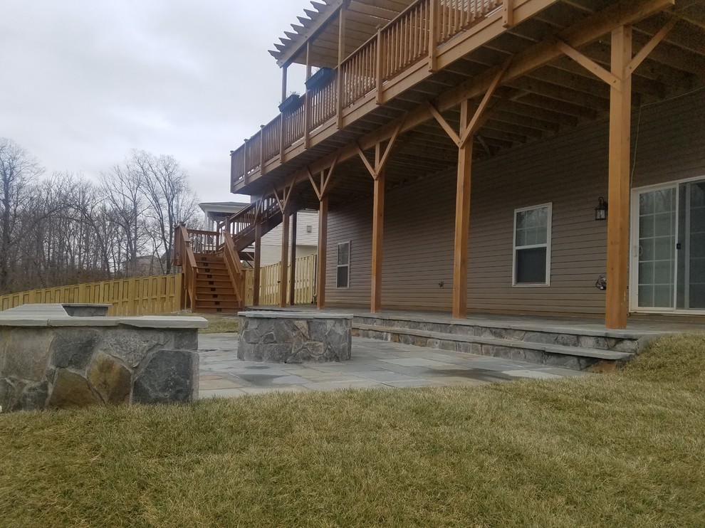 Stepped Flagstone Patio with Fire Pit and Seating Walls - Rustic ...