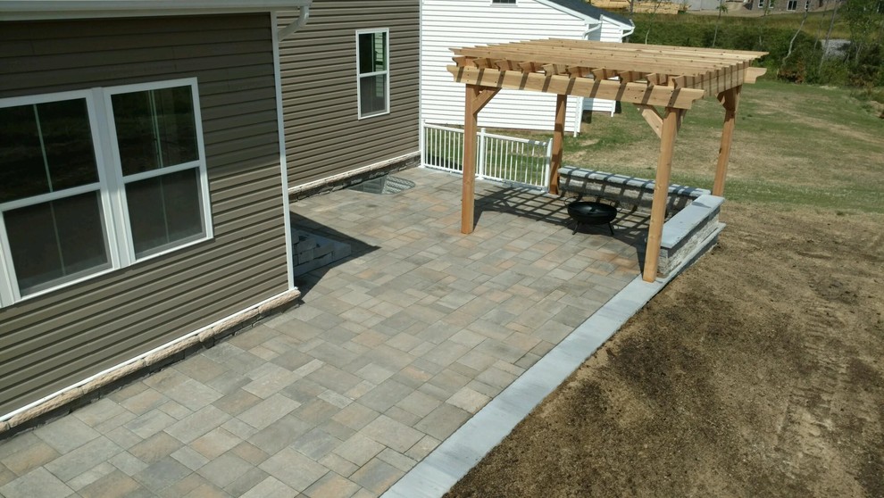 Techo Bloc raised patio, sitting walls and cedar pergola - Craftsman ...