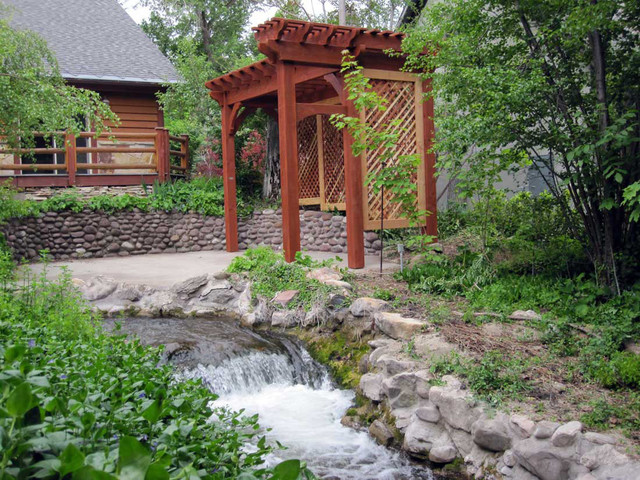 Timber Frame Arbor with Privacy Trellis next to Backyard Stream ...