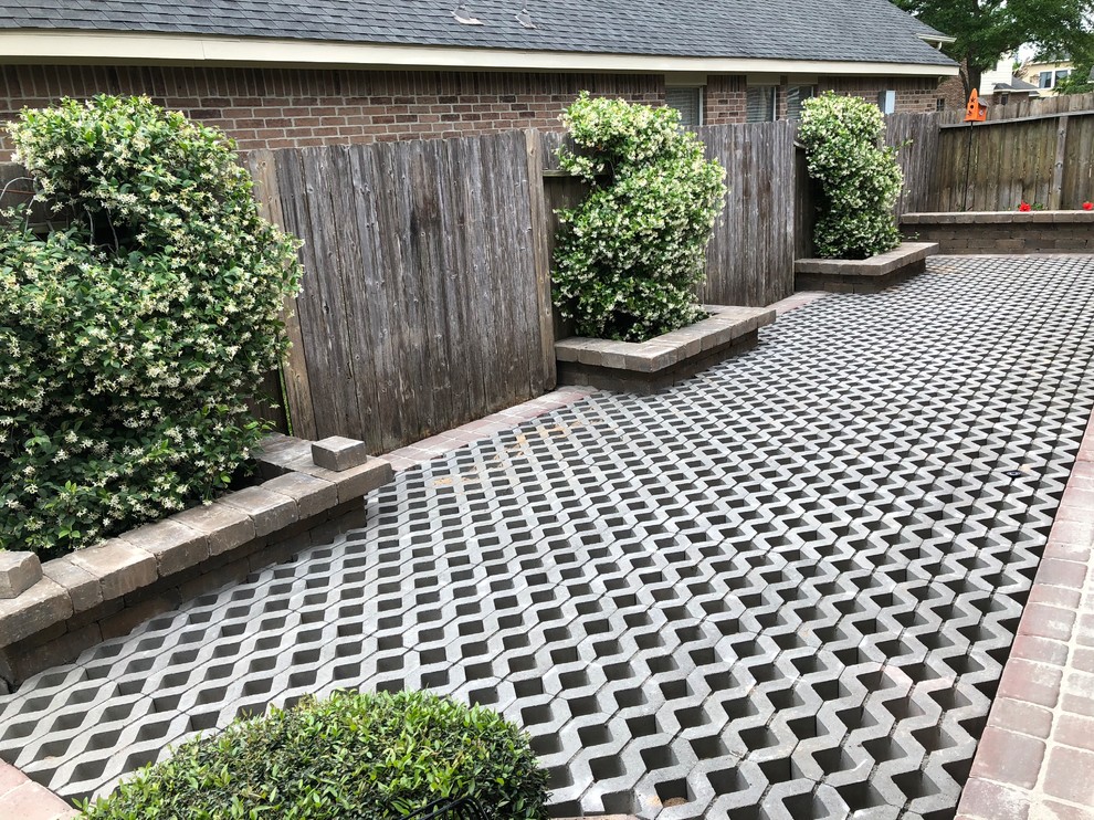 Turfstone Patio with Weston wall Flower Beds - Tropical - Patio ...