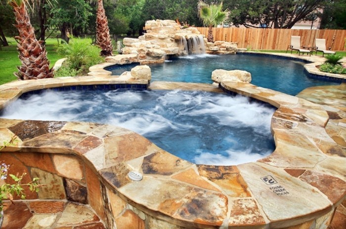 Beautiful spa with flagstone coping overlooking the pool - Rustic ...