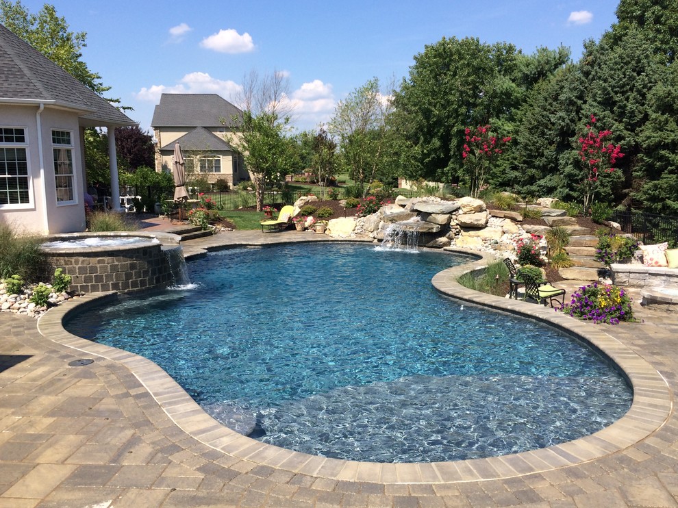 Bethlehem Township pool and spa with waterfall and sunshelf ...