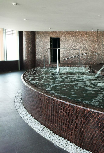 Contemporary indoor jacuzzi with recycled glass mosaic tile ...