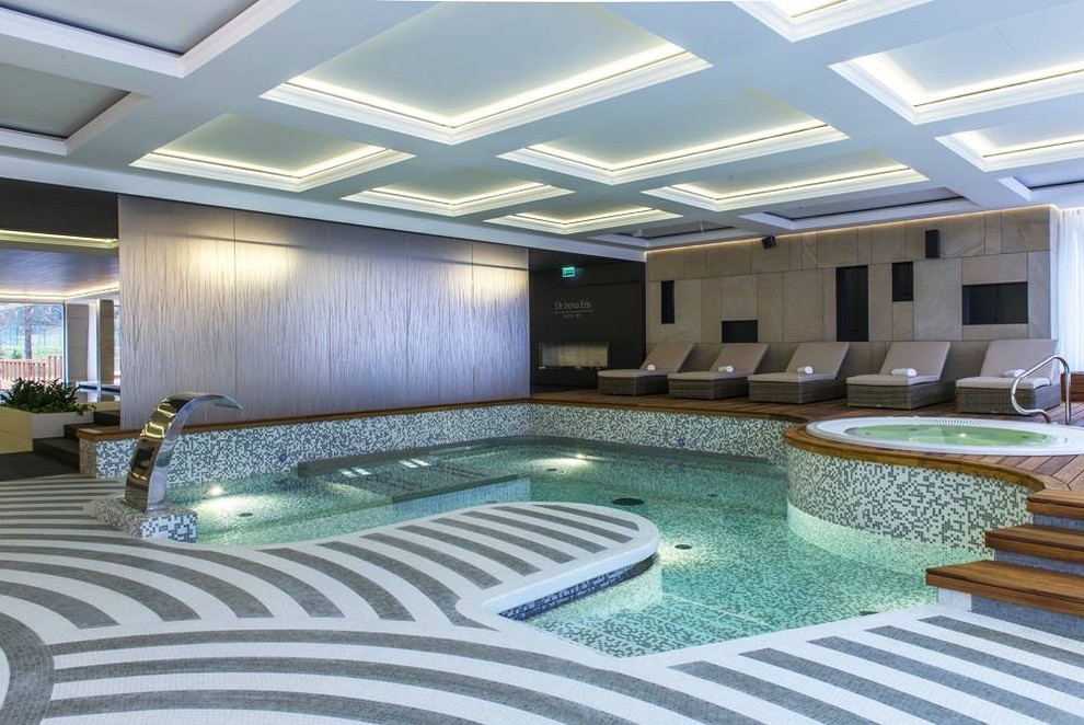 Contemporary indoor pool and spa with recycled glass mosaic ...