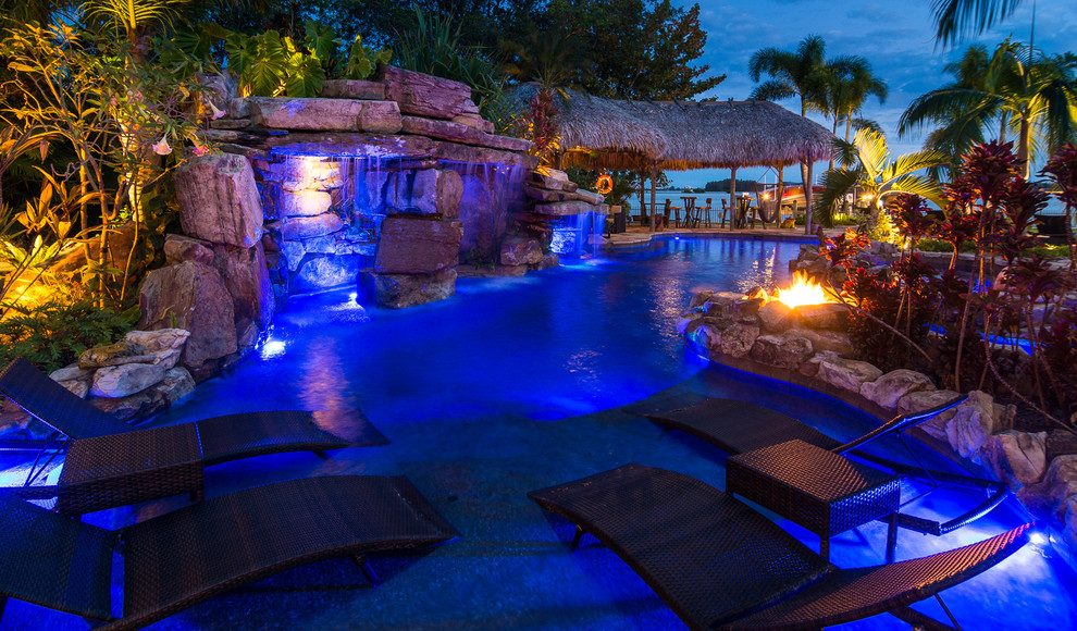 Custom Rock Waterfall Pool With Stone Grotto Stream And Tiki Hut Tropical Pool Tampa By