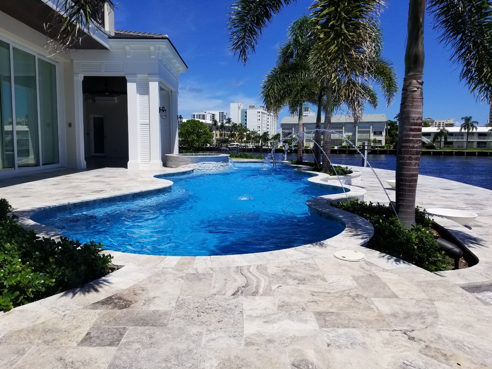 Custom Shaped Pool with Sun Shelf, Spa and Laminar Deck Jets in Pompano ...