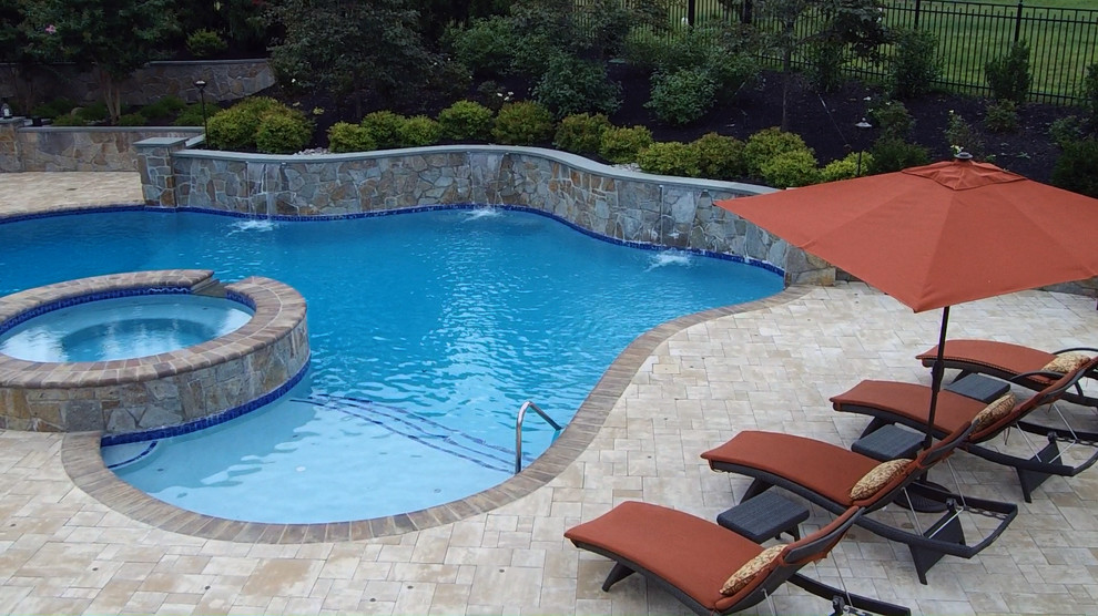 Freeform Pool with Raised Bond Beam and Sheer Descents - Pool ...