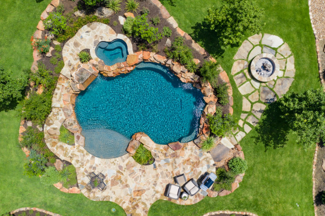 Freeform pool with weeping wall, grotto, and spa in San Antonio, Tx ...