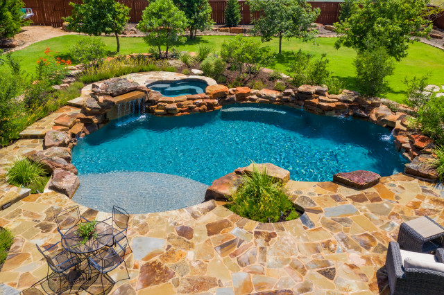 Freeform pool with weeping wall, grotto, and spa in San Antonio, Tx ...