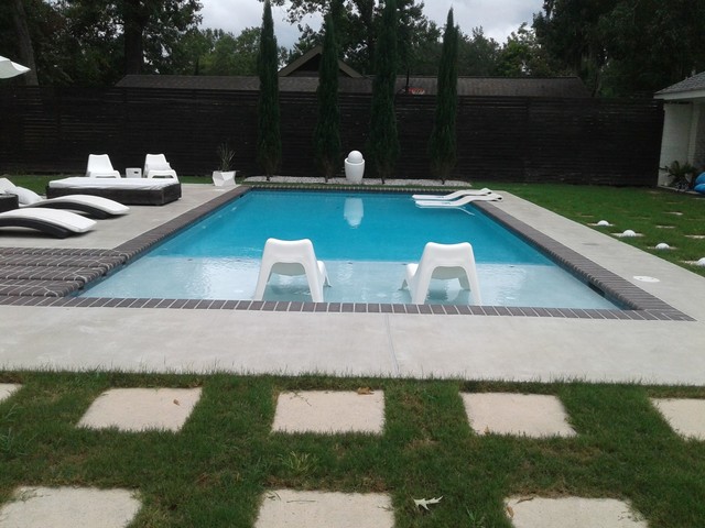 Geometric pool with separate spa, bullnose brick coping and grass ...