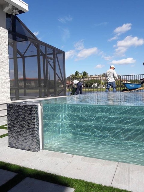 glass wall pool with sunken living room - Industrial - Swimming Pool ...