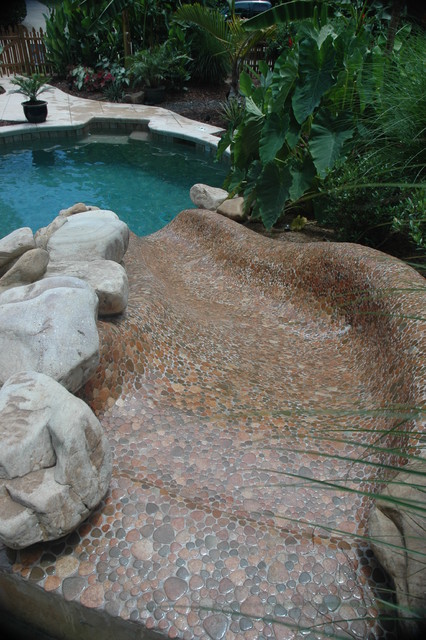 Hidden slide and tropical pool! - Tropical - Swimming Pool & Hot Tub ...