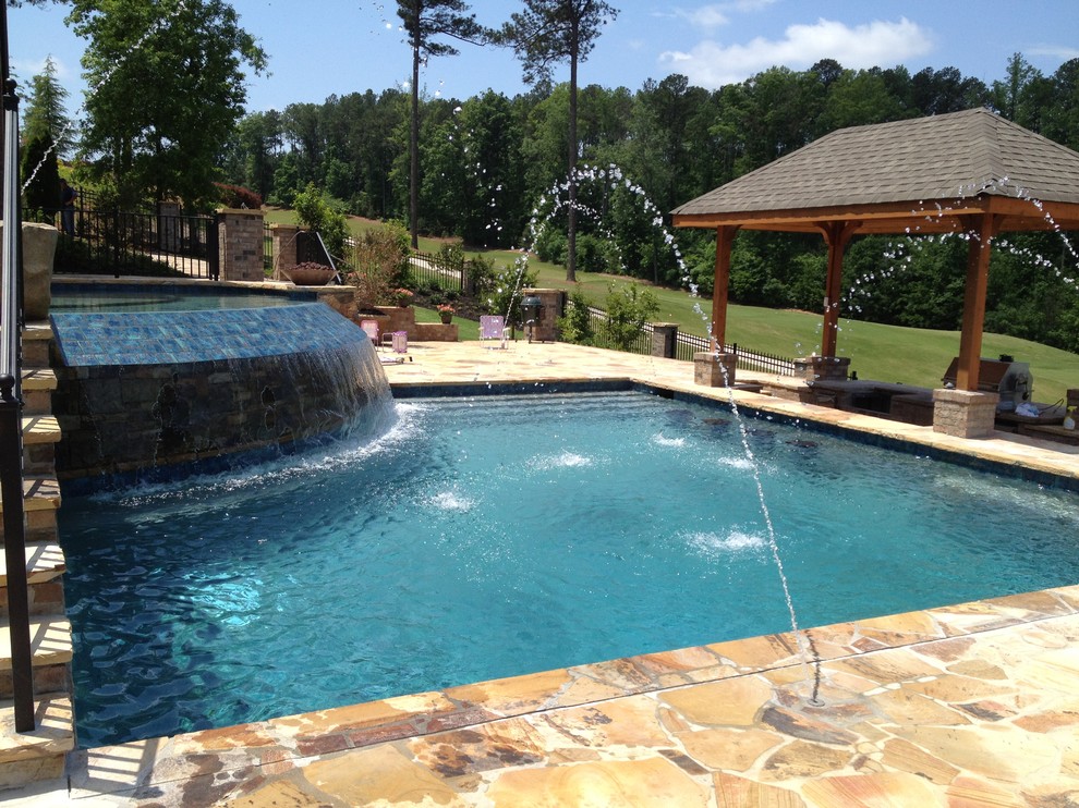 Infinity Edge with fountains, swim-up bar & sunken kitchen - Tropical ...