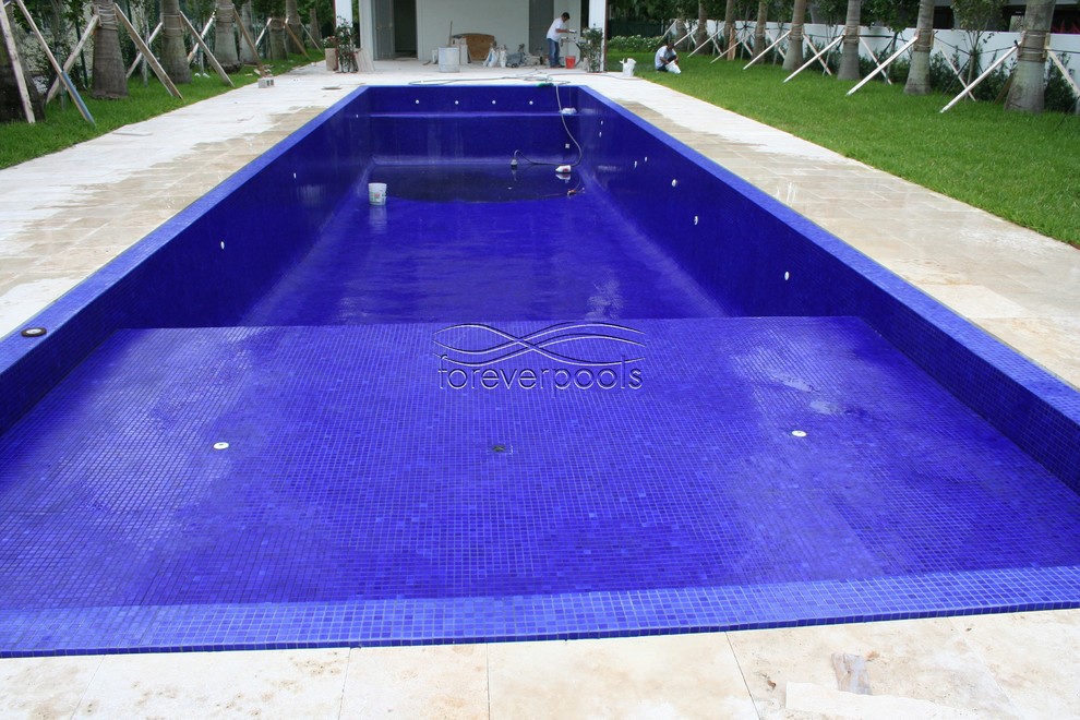 Infinity pool with solid dark blue glass tile - Contemporary - Pool ...