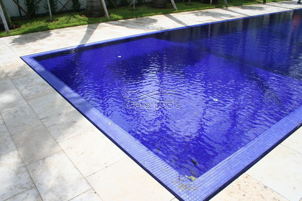 Infinity pool with solid dark blue glass tile - Contemporary - Pool ...