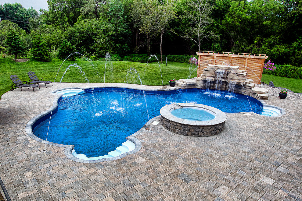 Inground pool with fountains, waterfall, and built in spa - Modern ...