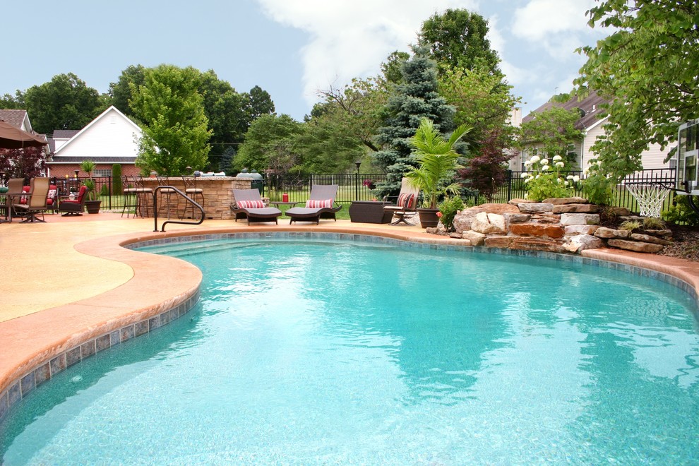 Lagoon with water feature and outdoor kitchen - Beach Style - Pool - St ...