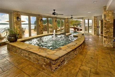 Lake House Pool with a 40' vanishing edge and a carved concrete slide ...