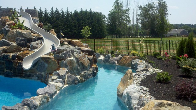 Large Pool with boulder waterfall ,water slide and a lazy river ...