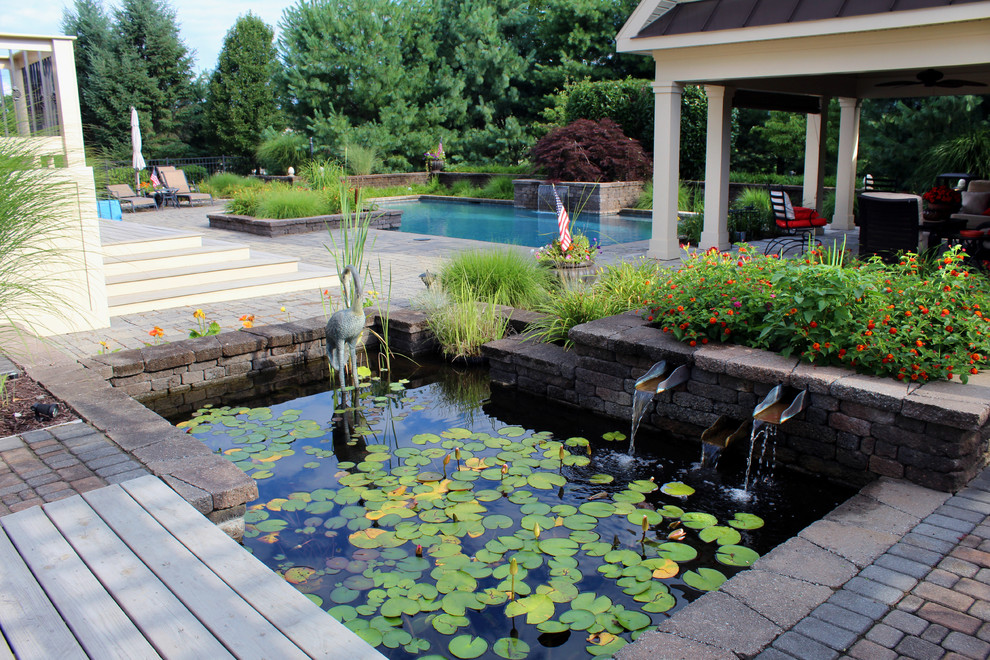 Lower Saucon custom pool with raised planters & sheer descent waterfall ...