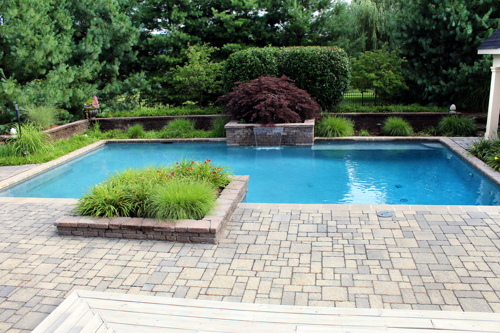 Lower Saucon custom pool with raised planters & sheer descent waterfall ...
