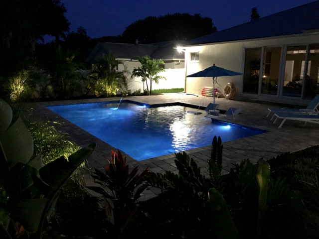 Modern Pool with Advanced LED Lighting and Water Features - Tropical ...