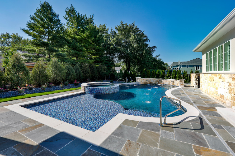 Naperville, IL freeform swimming pool with hot tub, large sunshelf ...