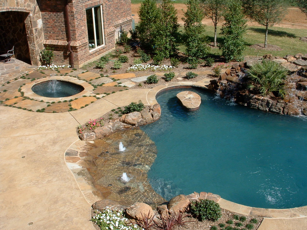 Natural Beach Entry Freeform Pool with slide, table and cascading ...