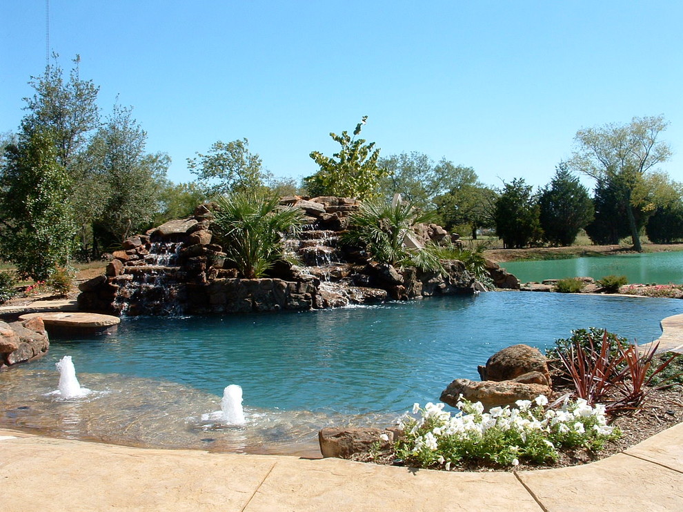 Natural Beach Entry Freeform Pool with slide, table and cascading ...