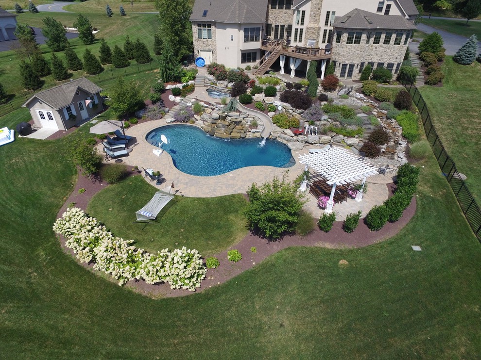 North Whitehall custom pool with boulder waterfall, slide, & separate ...