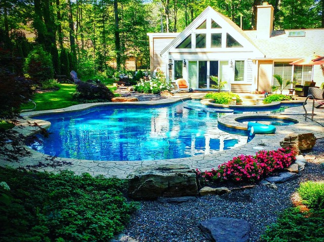Pool and spa with a sunken fire pit. - Tropical - Swimming Pool & Hot ...