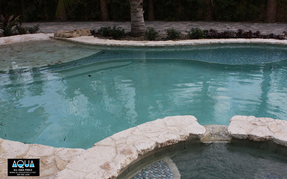 Pool and Spa with Beach Entry and Rock Waterfall - Tropical - Swimming ...