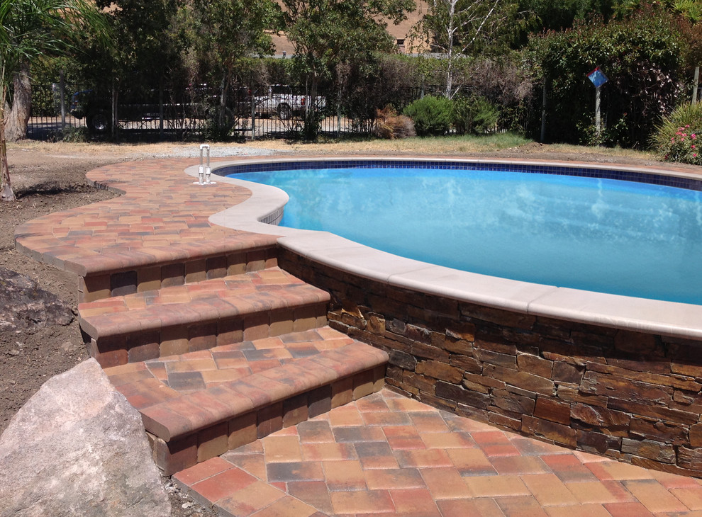Pool with Copper Loose Stone Veneer and Pavers - Traditional - Swimming ...