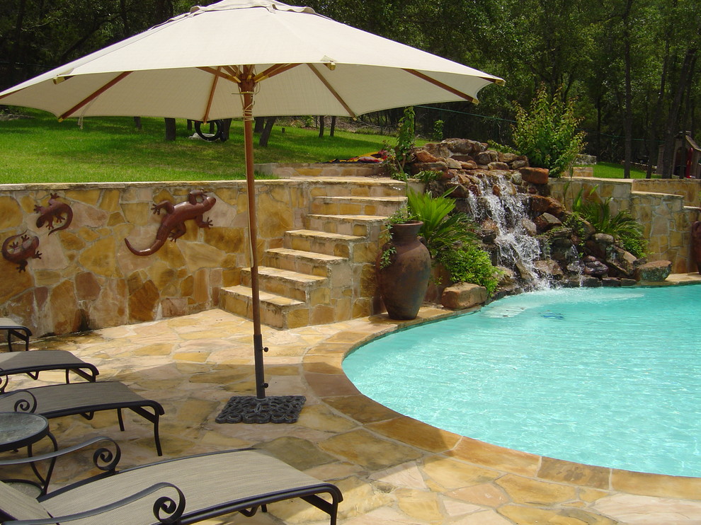 Pool with Moss Rock Waterfall and Flagstone Deck - Tropical - Swimming ...