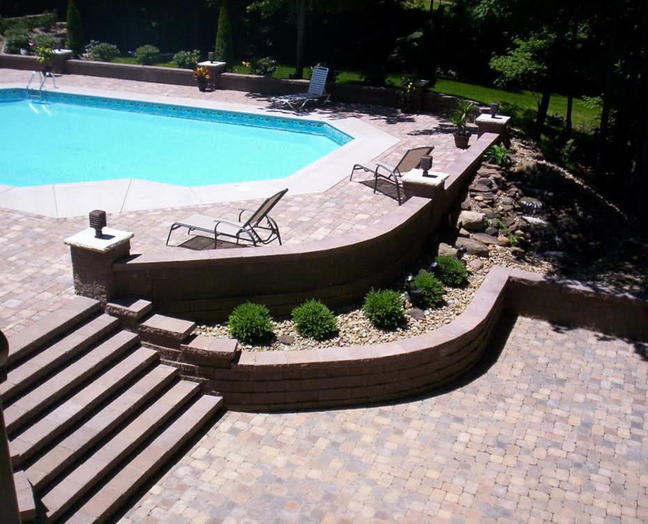Poolside brick patio with retaining walls - Pool - Other - by Buckeye ...