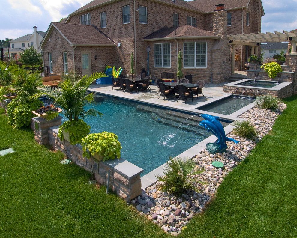 Raised Spa connected to pool with auto cover, fire/water pots and water ...