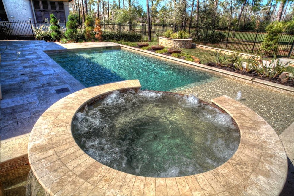 Rectangular pool with walkover water feature, fire pit, and landscape ...
