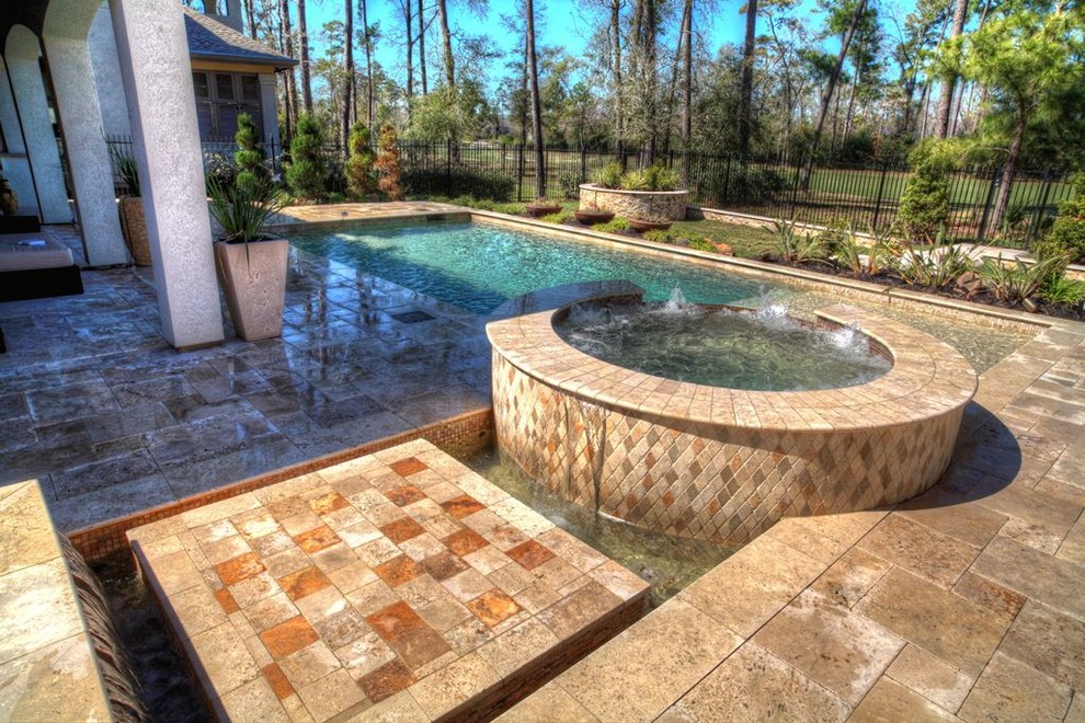 Rectangular pool with walkover water feature, fire pit, and landscape ...