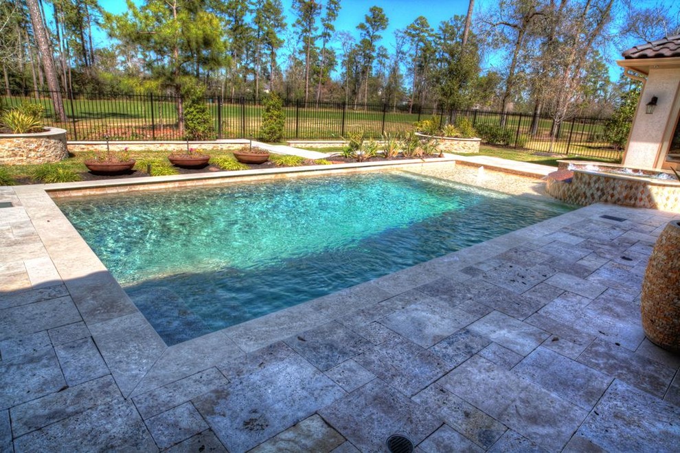 Rectangular pool with walkover water feature, fire pit, and landscape ...