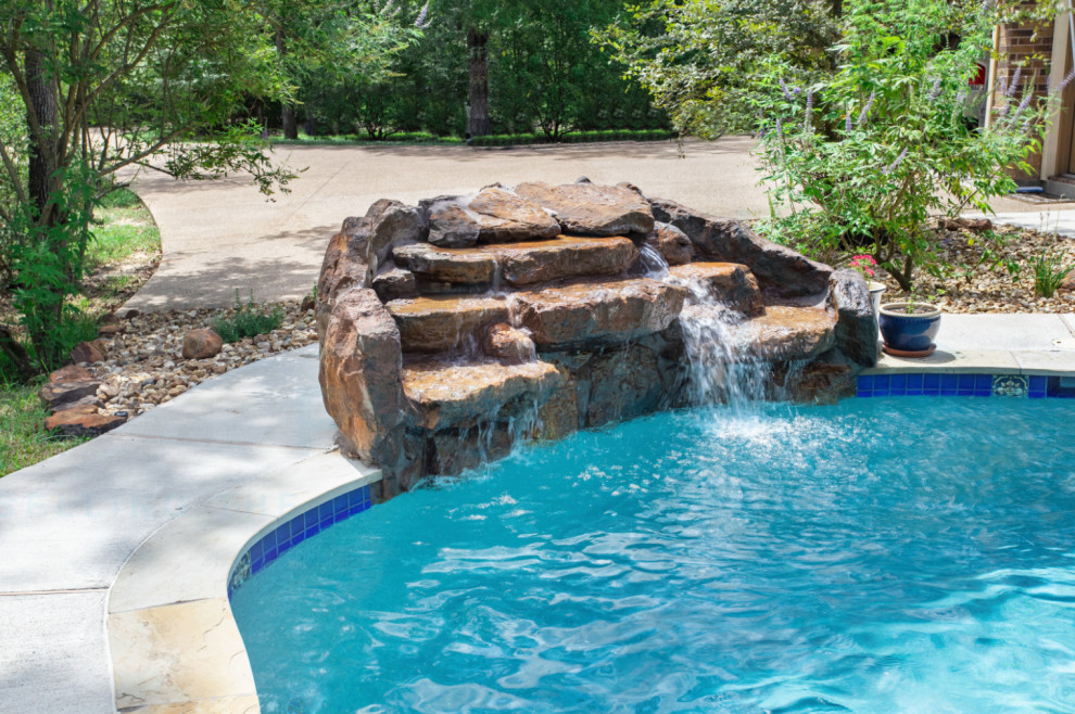 Rock Waterfall on a Freeform Pool - Pool - by Paradise Oasis Pools | Houzz