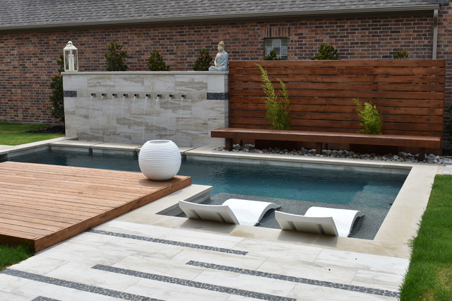 Sleek And Contemporary Porcelain Pool With Stone And Wood Backdrops