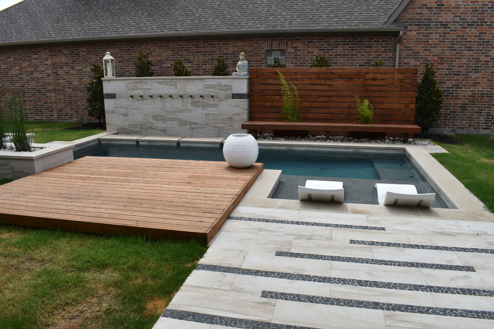 Sleek and Contemporary Porcelain Pool With Stone and Wood Backdrops ...
