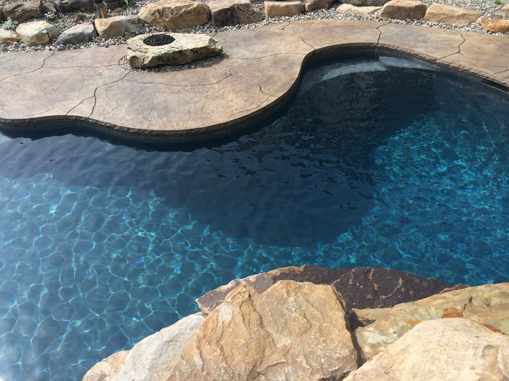 Spring Brook Township custom pool with boulders and waterfall ...