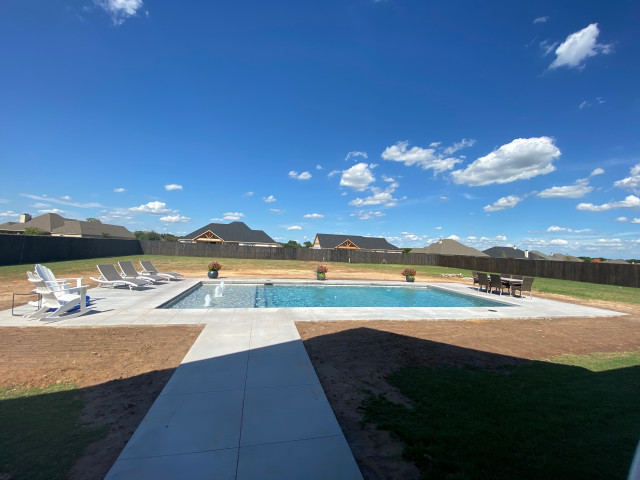 StoneScapes French Gray plaster, Massa Calacatta tile, and a scored ...