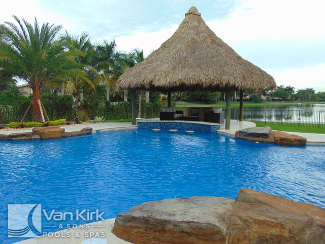 Tiki Hut with bar Area for Custom Pool with Rock Waterfall and Wet Edge ...
