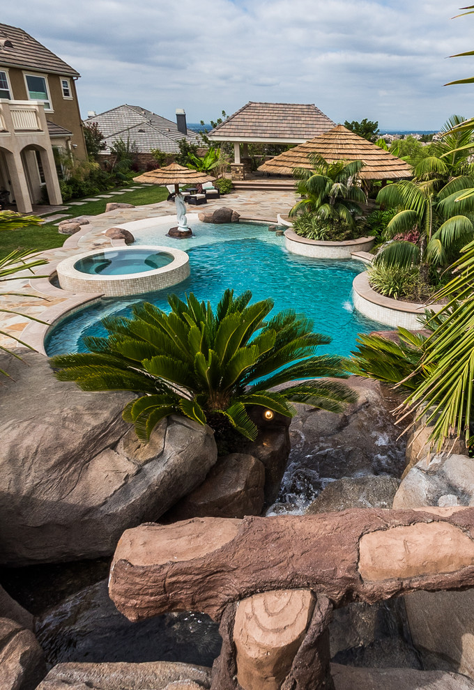 Tropical Beach Entry Pool & Spa with a Rock Slide & Grotto - Tropical ...