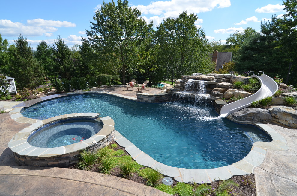 Upper saucon pool with waterslide and swim up bar - Tropical - Pool ...