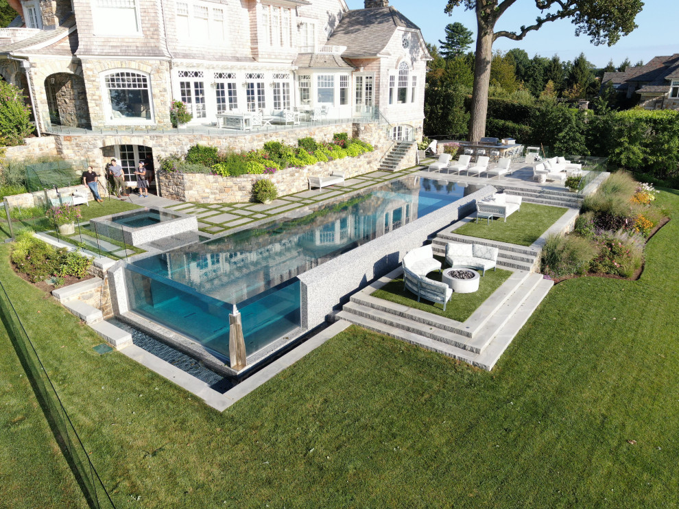 vanishing edge glass wall pool + raised perimeter overflow spa ...